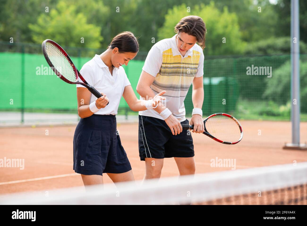 Girl holding two tennis hi-res stock photography and images - Alamy