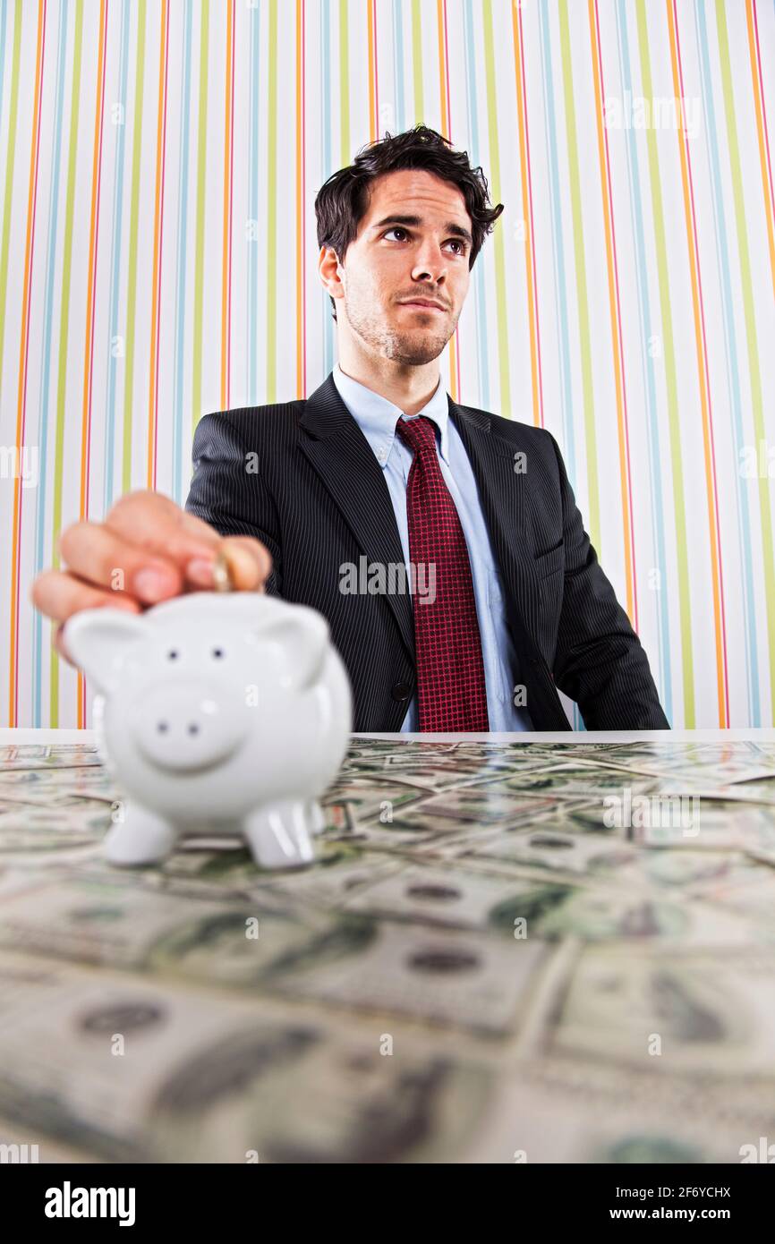Businessman at his office with lots of money Stock Photo - Alamy