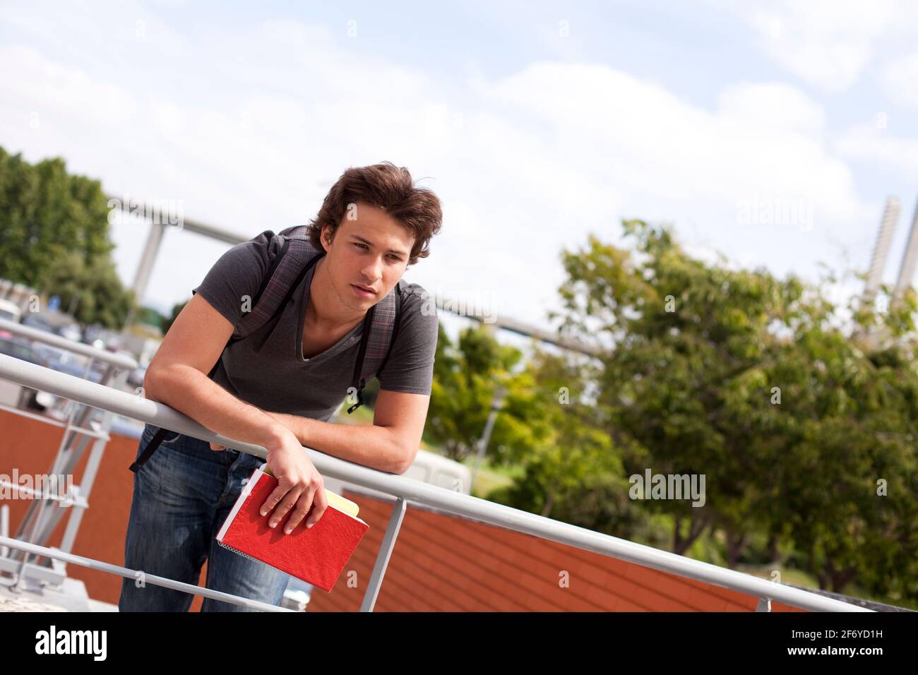 teenager student outside the school looking away Stock Photo - Alamy