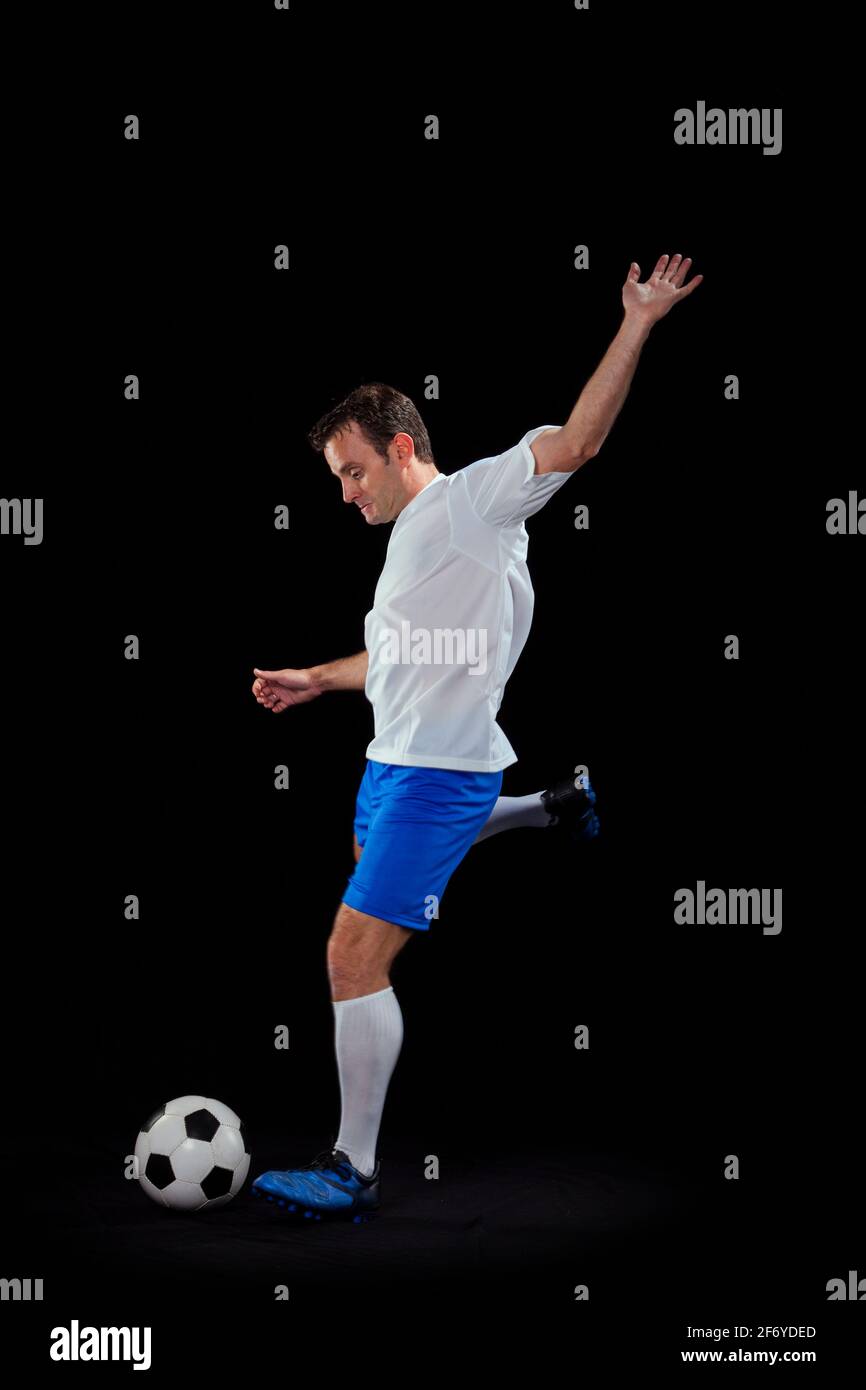 Soccer player with a soccer ball Stock Photo - Alamy
