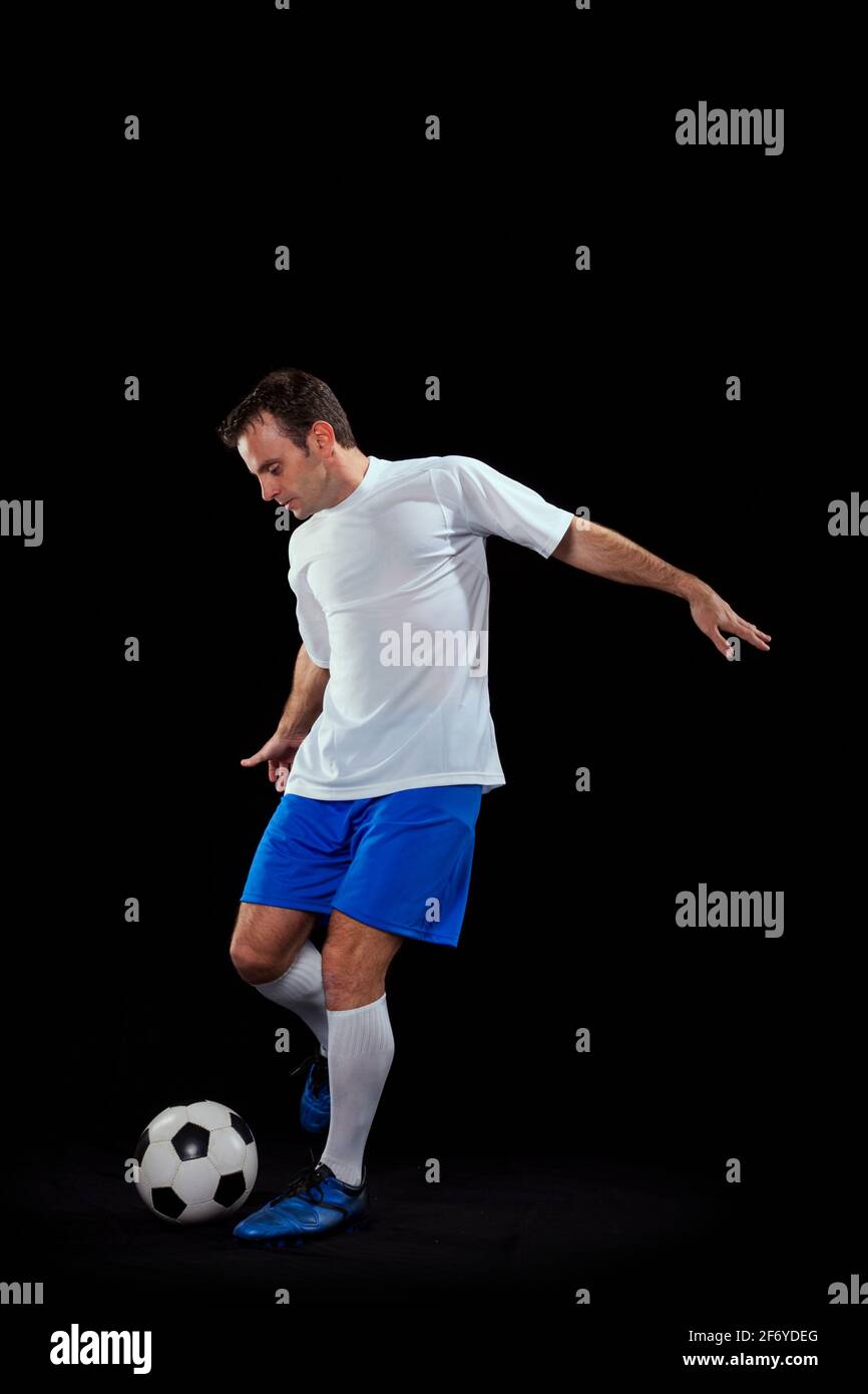 Soccer player with a soccer ball Stock Photo - Alamy