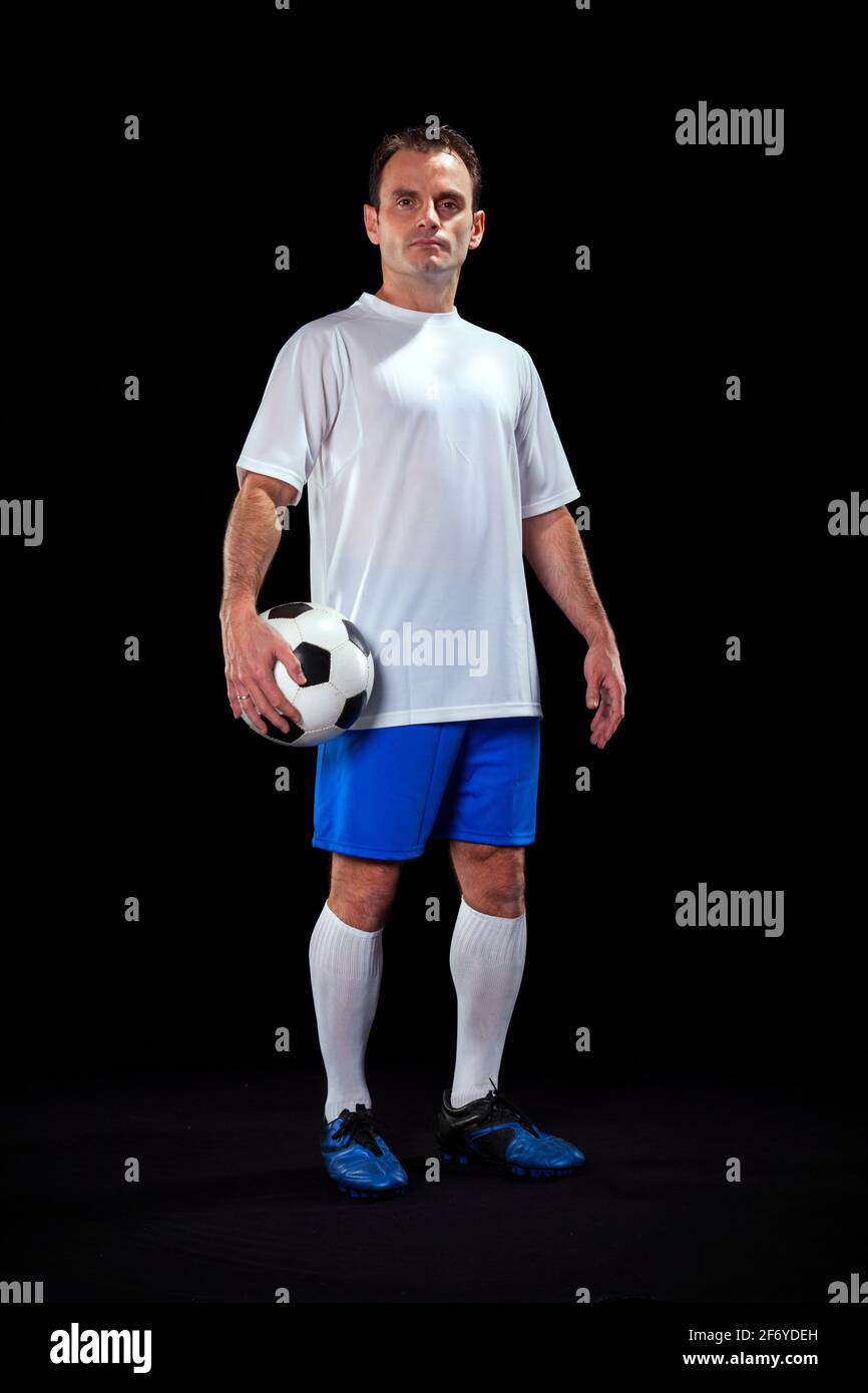 Soccer player with a soccer ball Stock Photo - Alamy