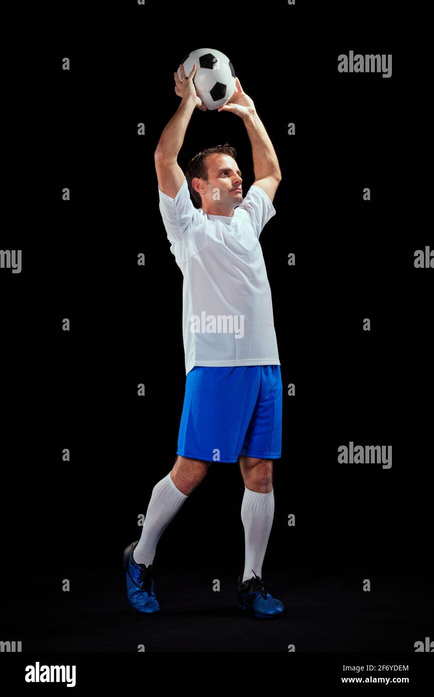 Soccer player with a soccer ball Stock Photo - Alamy