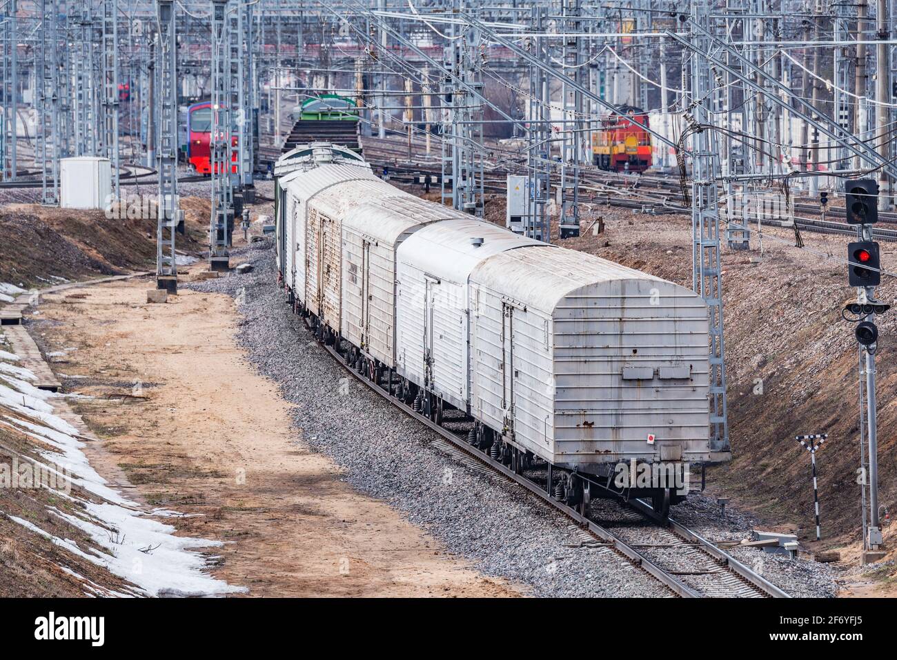 Long freight train approaches to the station Stock Photo - Alamy