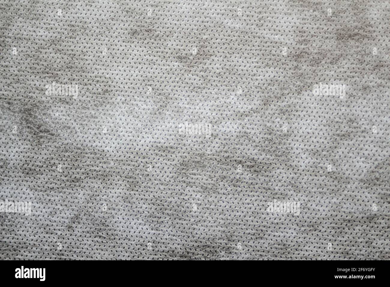 Defocus grey spunbond non-woven geotextile close-up macro. Close up ...