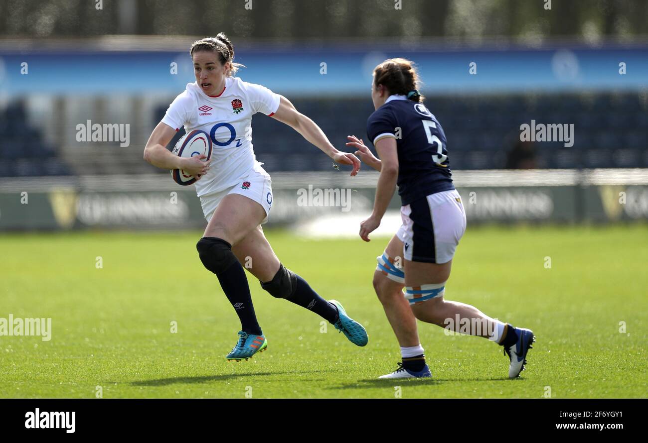England's Emily Scarratt (left) attempts to get past Scotland's Louise ...