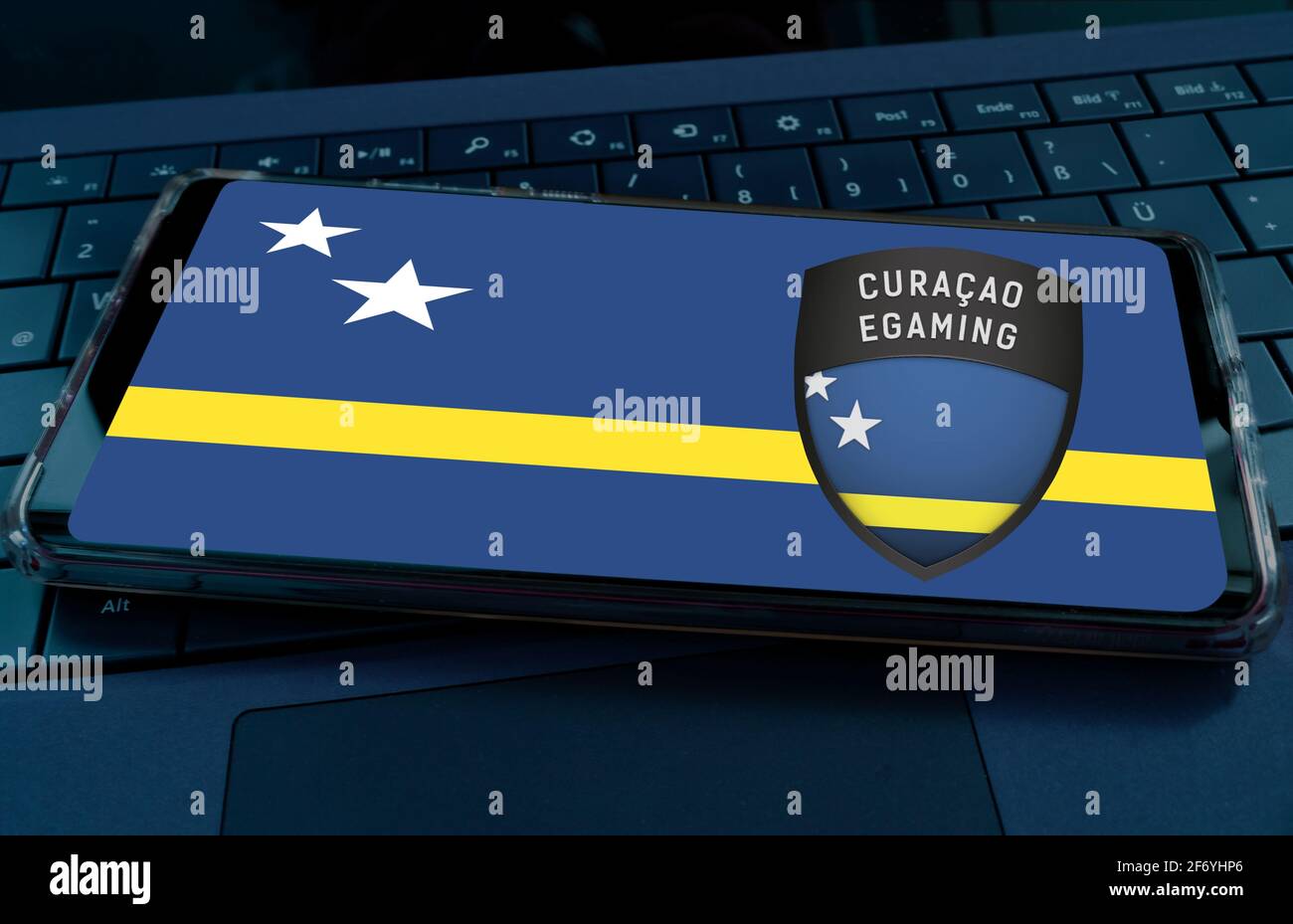 Germany, 25.03.2021: Curacao egaming logo lettering and flag with ...