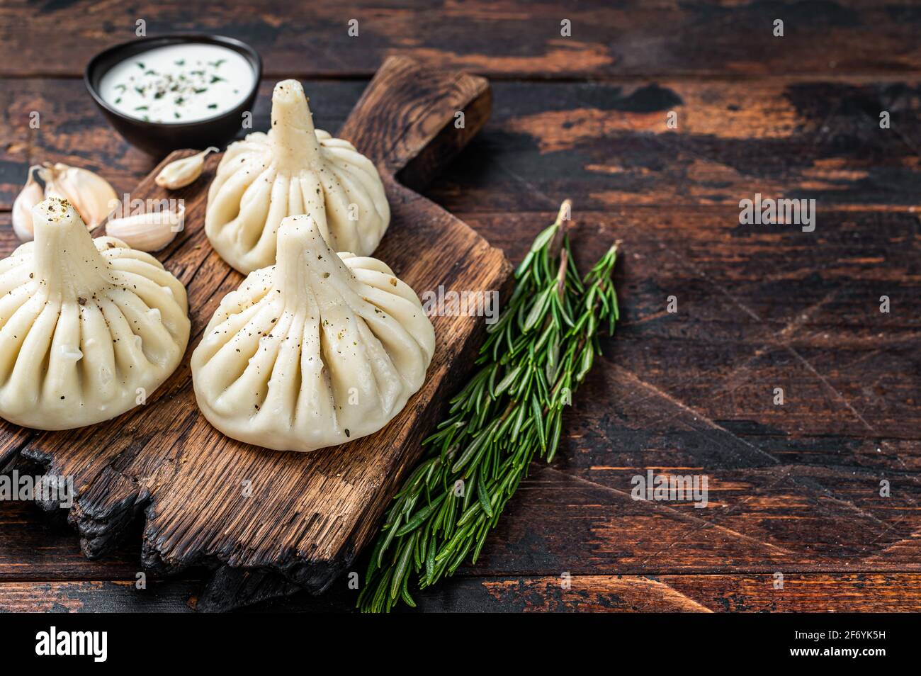 Georgian Khinkali Dumplings with beef and lamb meat on wooden board ...