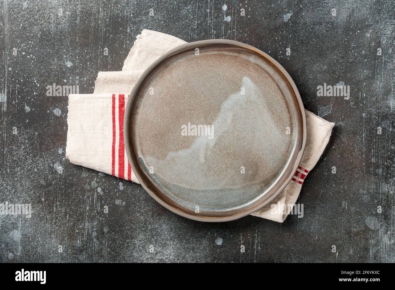 Rustic ceramic plate on rusty metal background Stock Photo - Alamy