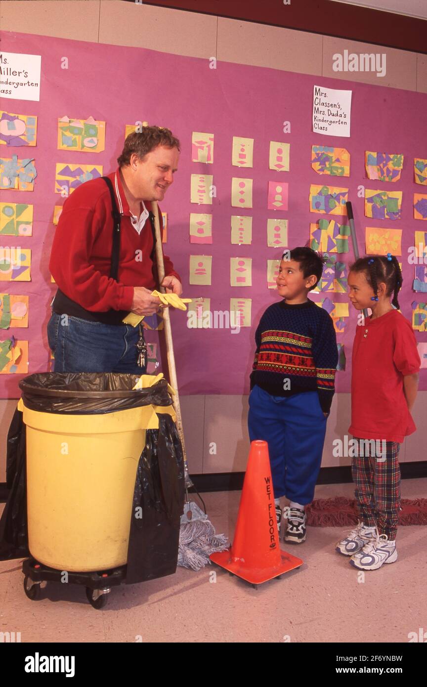 Austin, Texas, 1995: White male school custodian talks to students at ...
