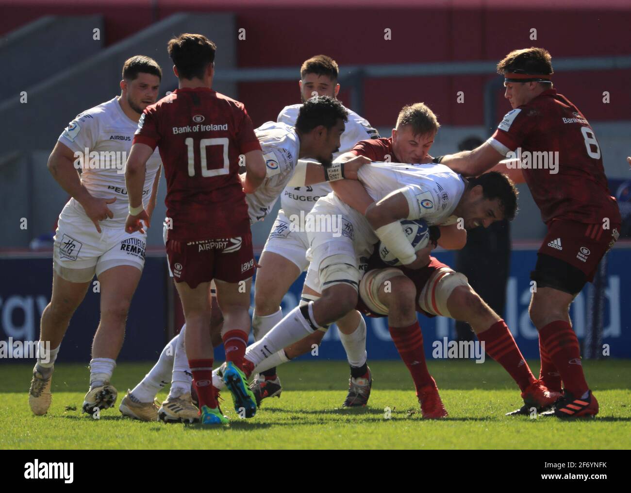 Toulouse's Rory Arnold is tackled by Munster Rugby's Gavin Coombes ...
