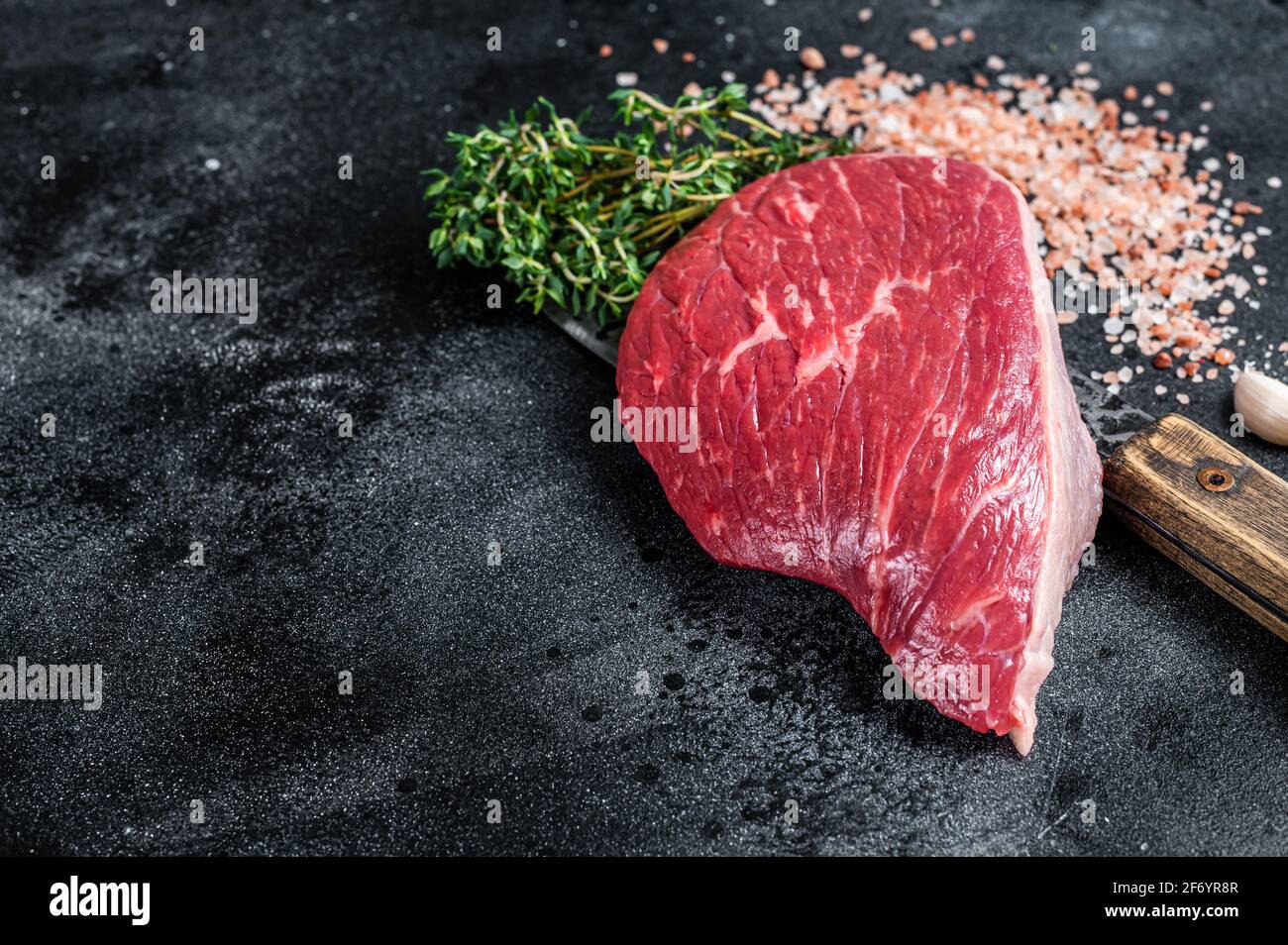 Fresh Raw rump beef cut or top sirloin cap steak on butcher cleaver ...
