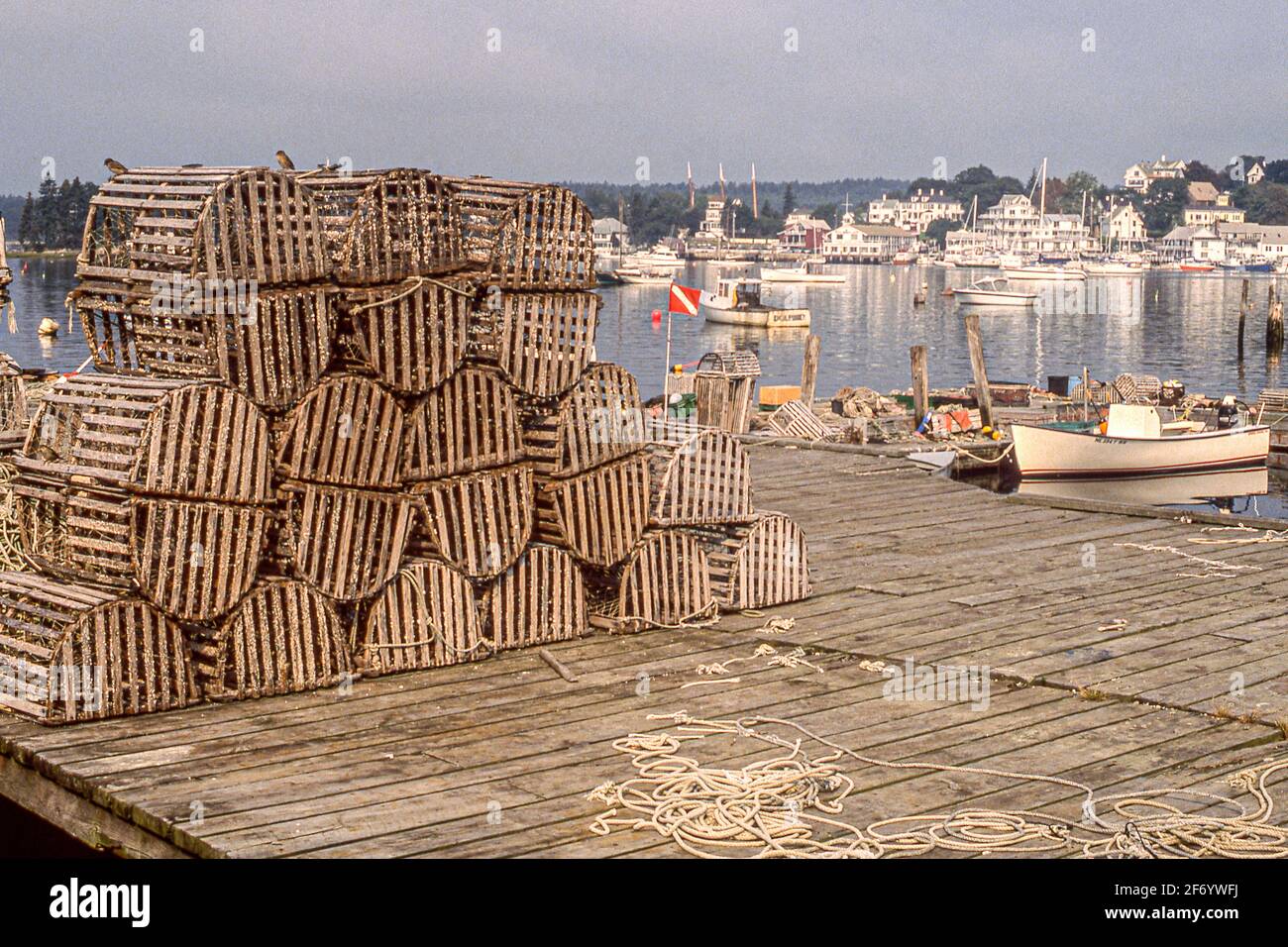 Old wooden lobster traps on the dock in Boothbay Harbor, Maine Stock ...