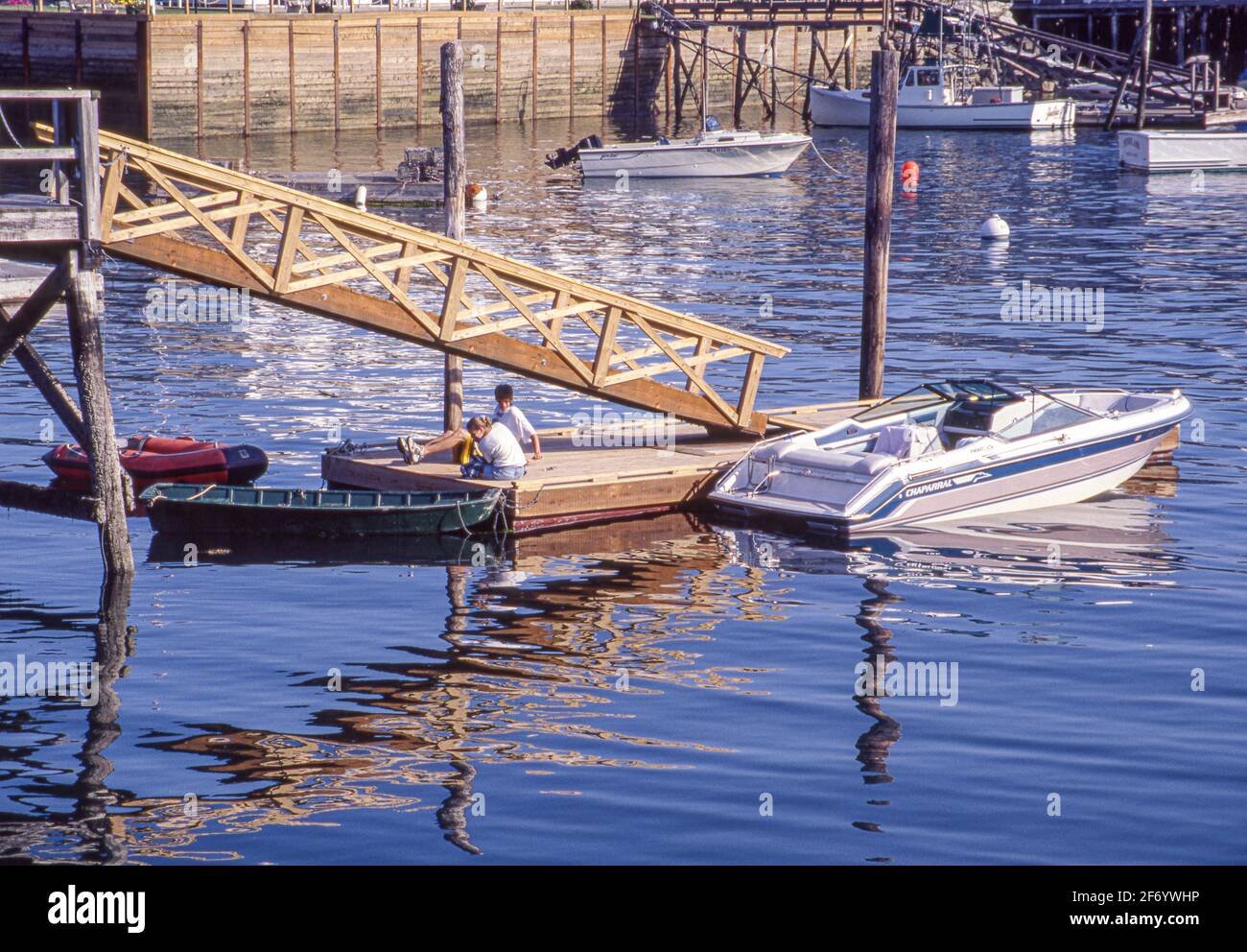 Man sitting on dock hi-res stock photography and images - Alamy
