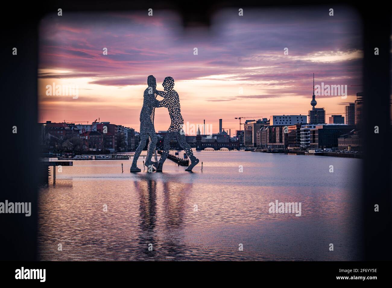 statue of Molecule Man in the river spree with view on berlin Stock ...