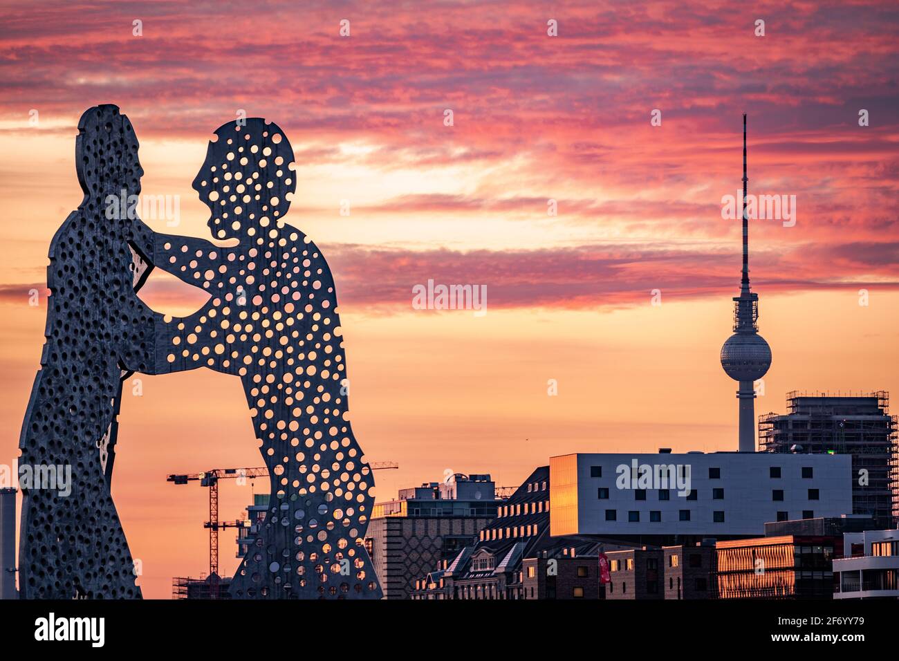 statue of Molecule Man with berlin tov tower in background during ...