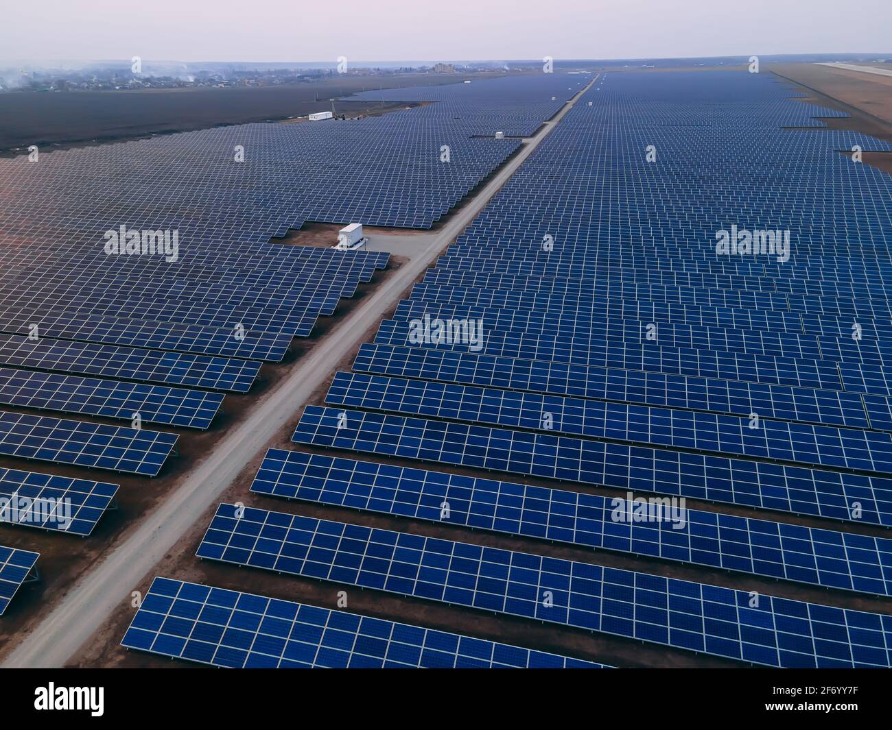 Aerial drone view of large solar panels at a solar farm at bright ...