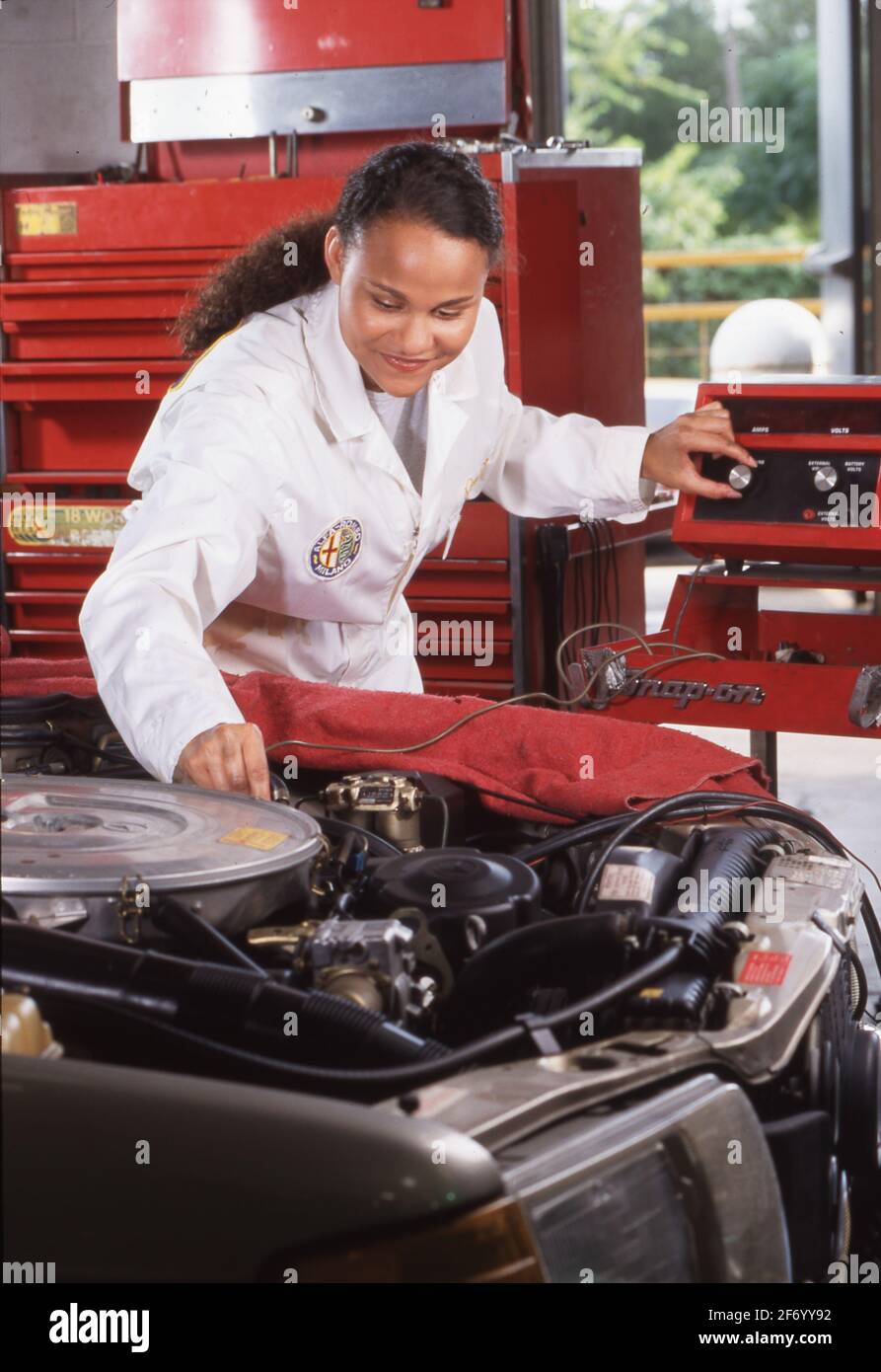 Austin, Texas USA, 1998: African-American female auto mechanic uses an ...