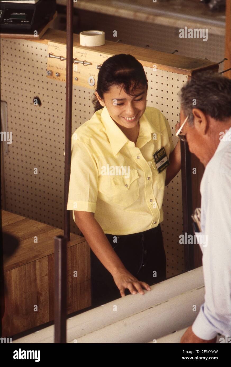 Clerk wearing store uniform hi-res stock photography and images - Alamy