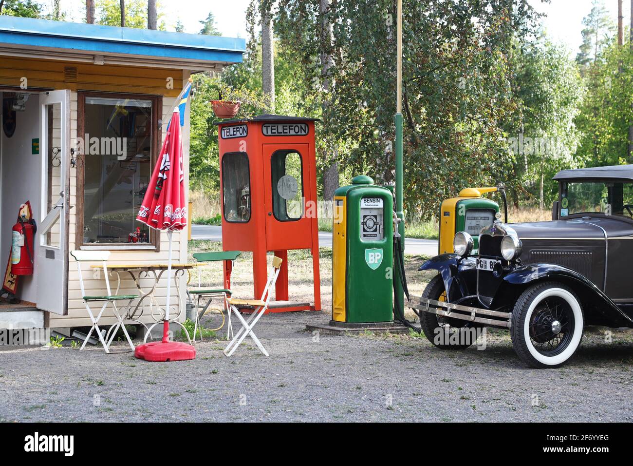 An old gas station with, among other things, BP signs. An old telephone ...
