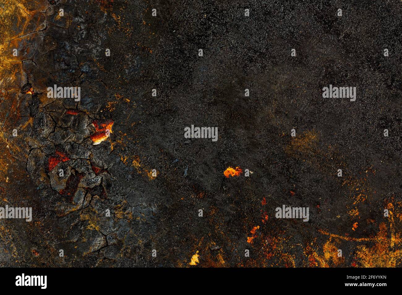 Bottom side of a cast iron pan with thicl layer of soot on it Stock ...