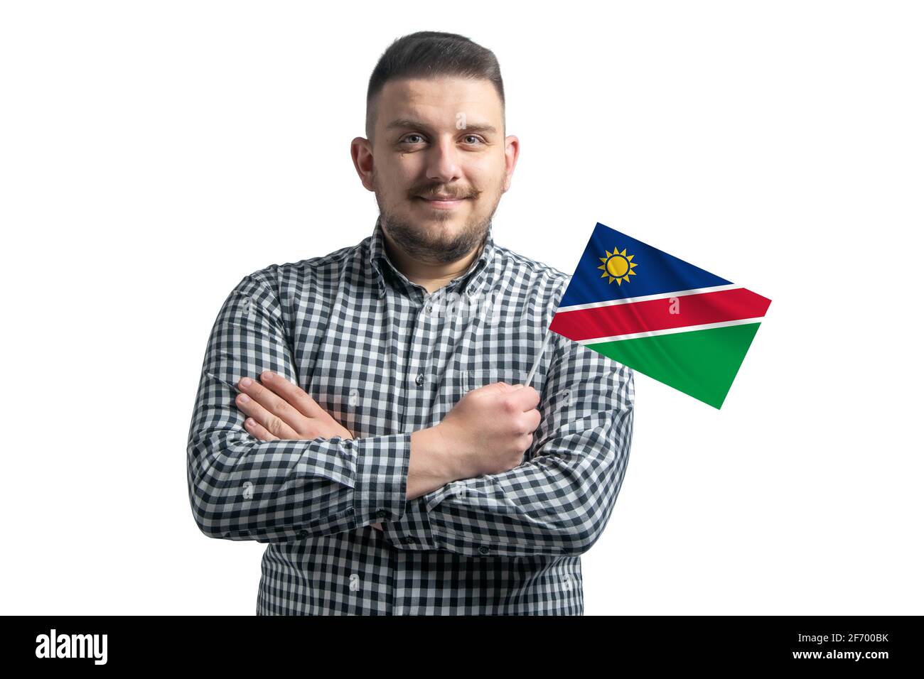 White guy holding a flag of Namibia smiling confident with crossed arms ...