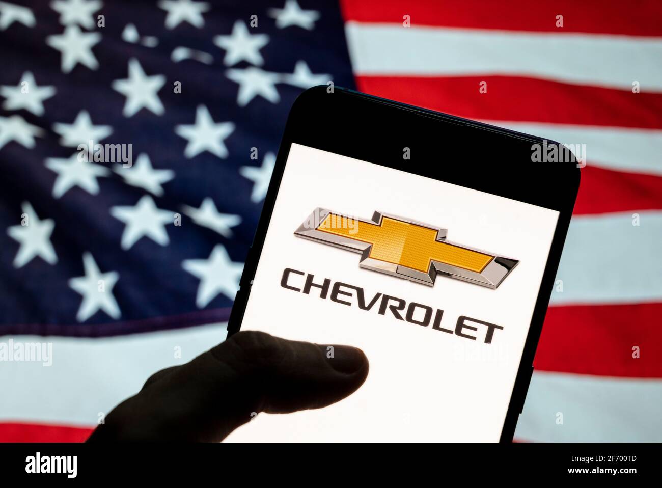 In this photo illustration the American automobile brand owned by ...