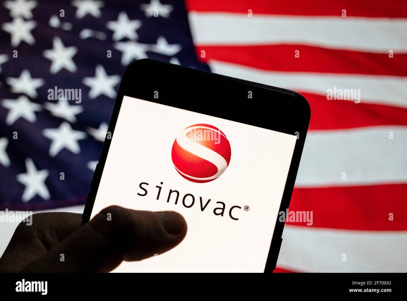 In this photo illustration the Chinese Sinovac vaccine logo for Covid ...