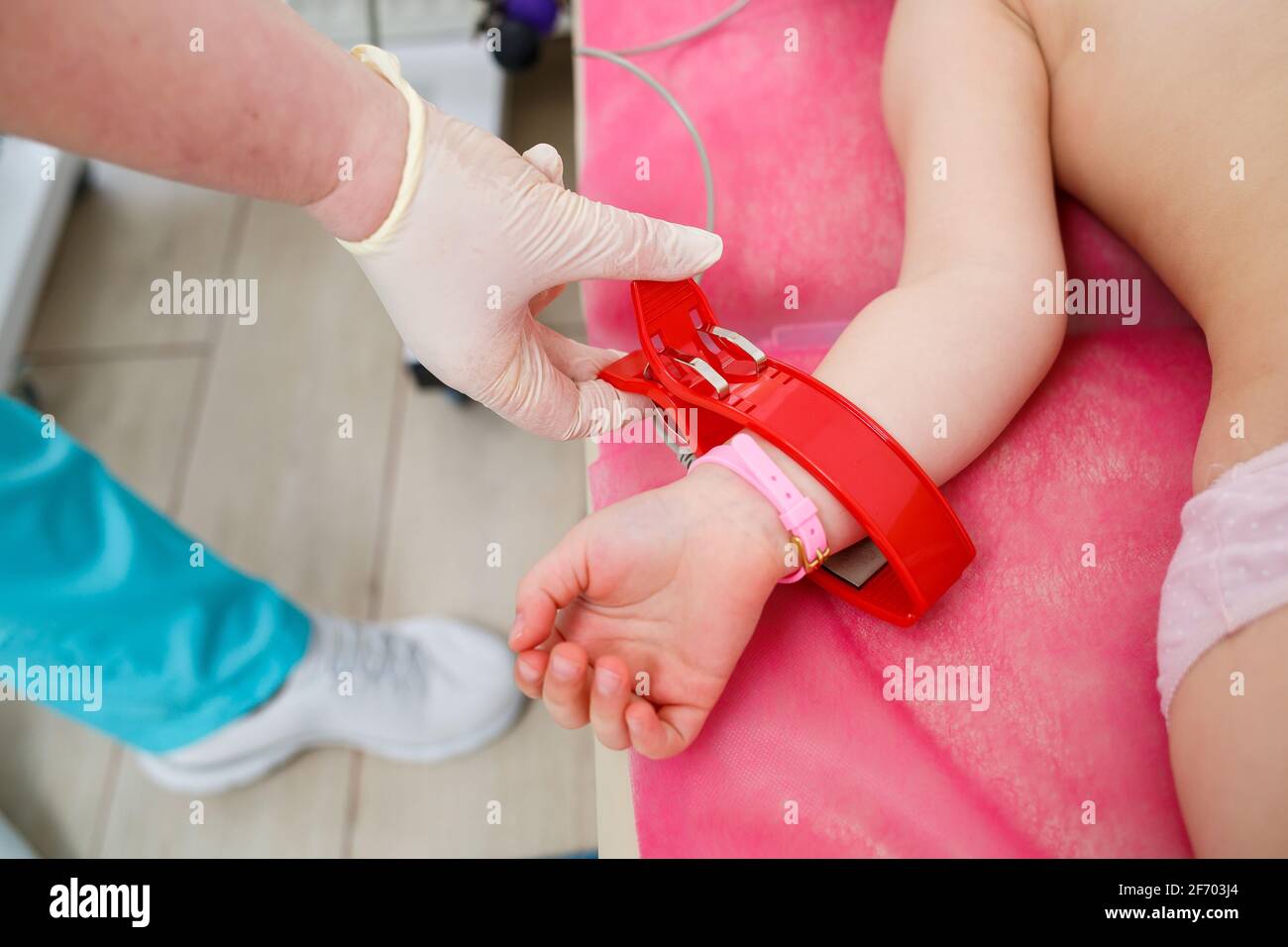 The child is being prepared for an electrocardiogram of the heart ...