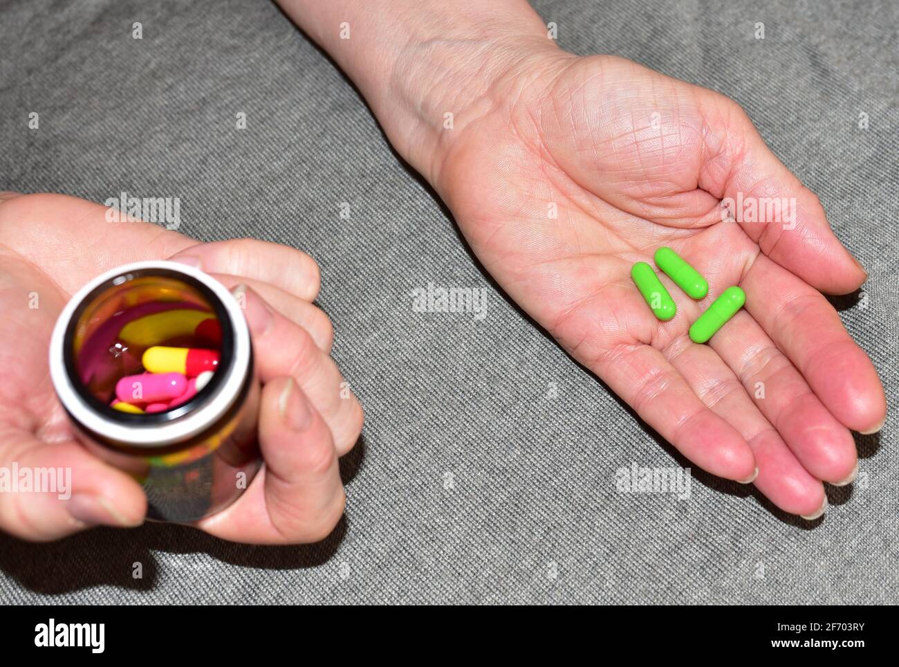 Pills in capsules in woomen hand. Medicine grade pharmaceutical tablets ...