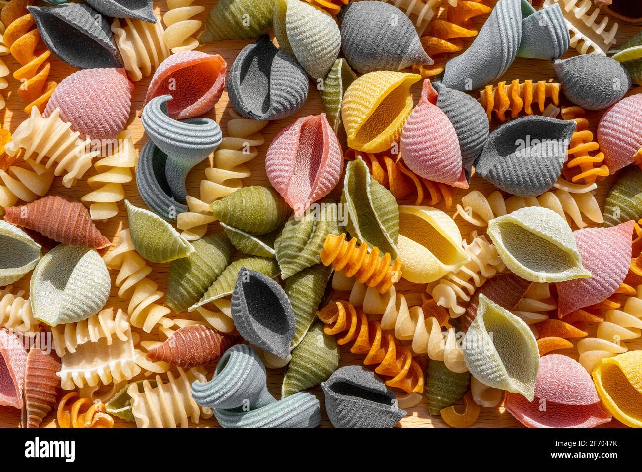 Different types of Italian colorful dry pasta as background. Macro ...