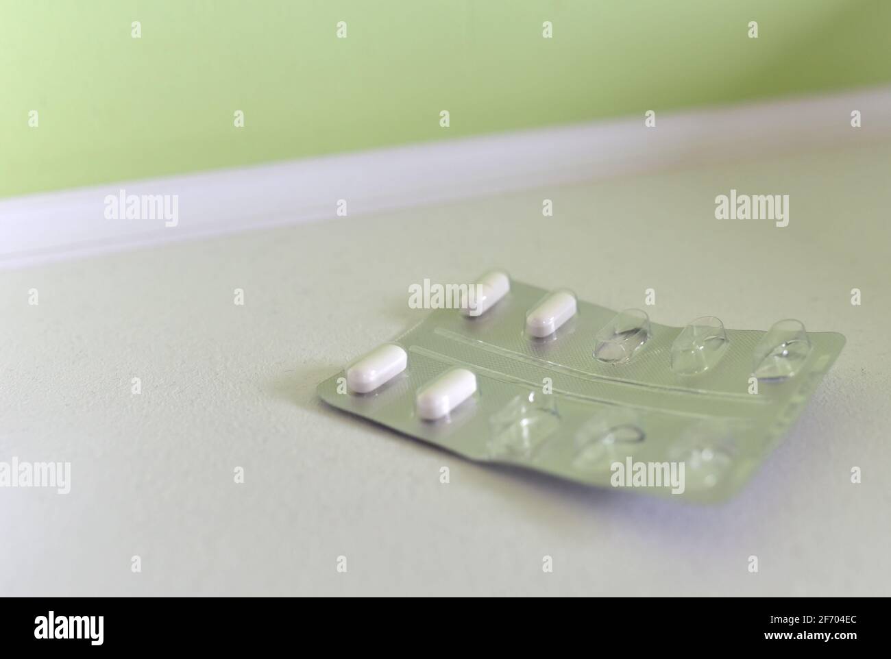 Pills in packpage on table. Medicine grade pharmaceutical tablets ...