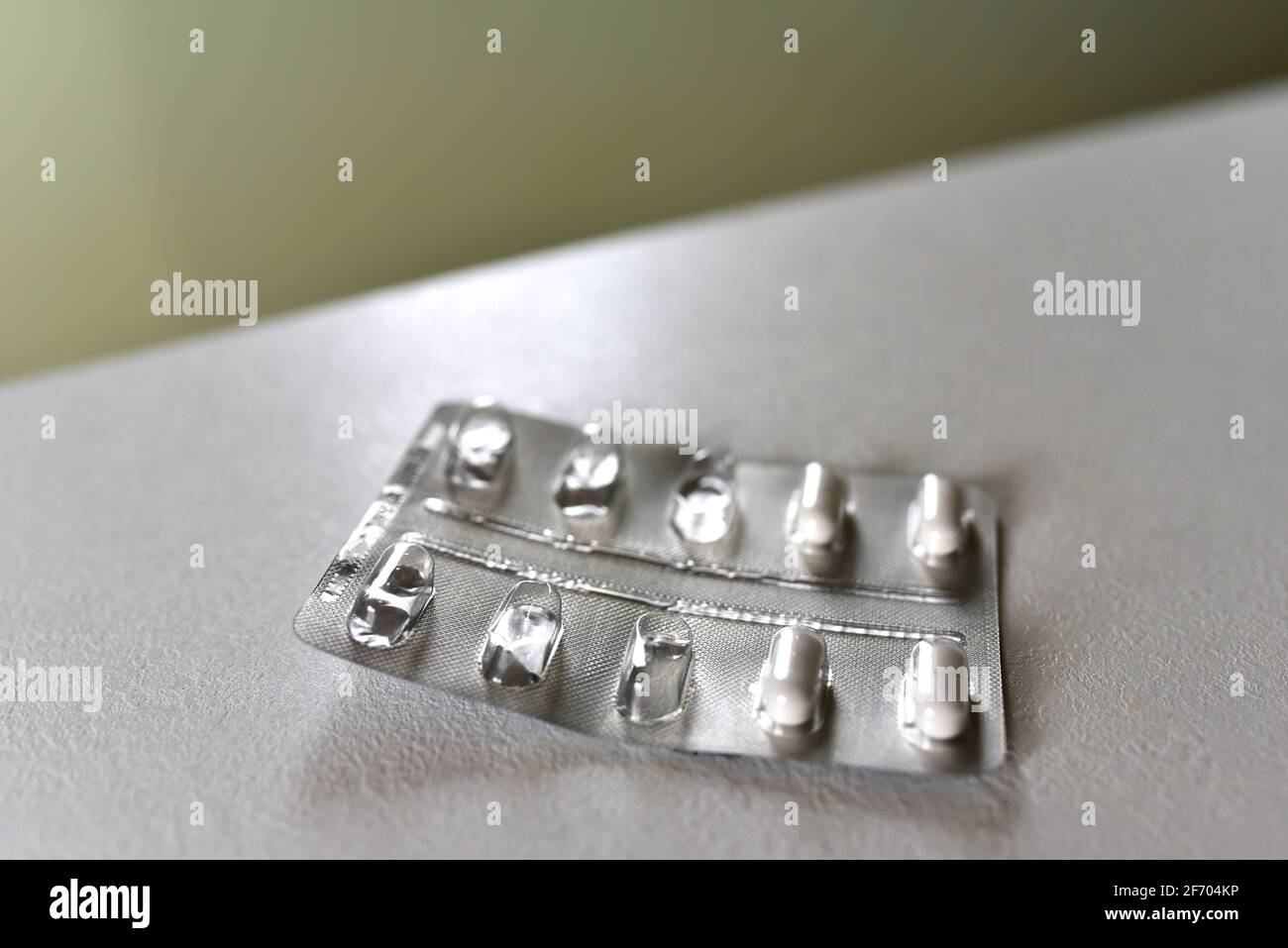 Pills in packpage on table. Medicine grade pharmaceutical tablets ...