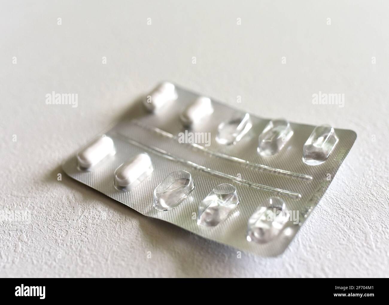 Pills in packpage on table. Medicine grade pharmaceutical tablets ...