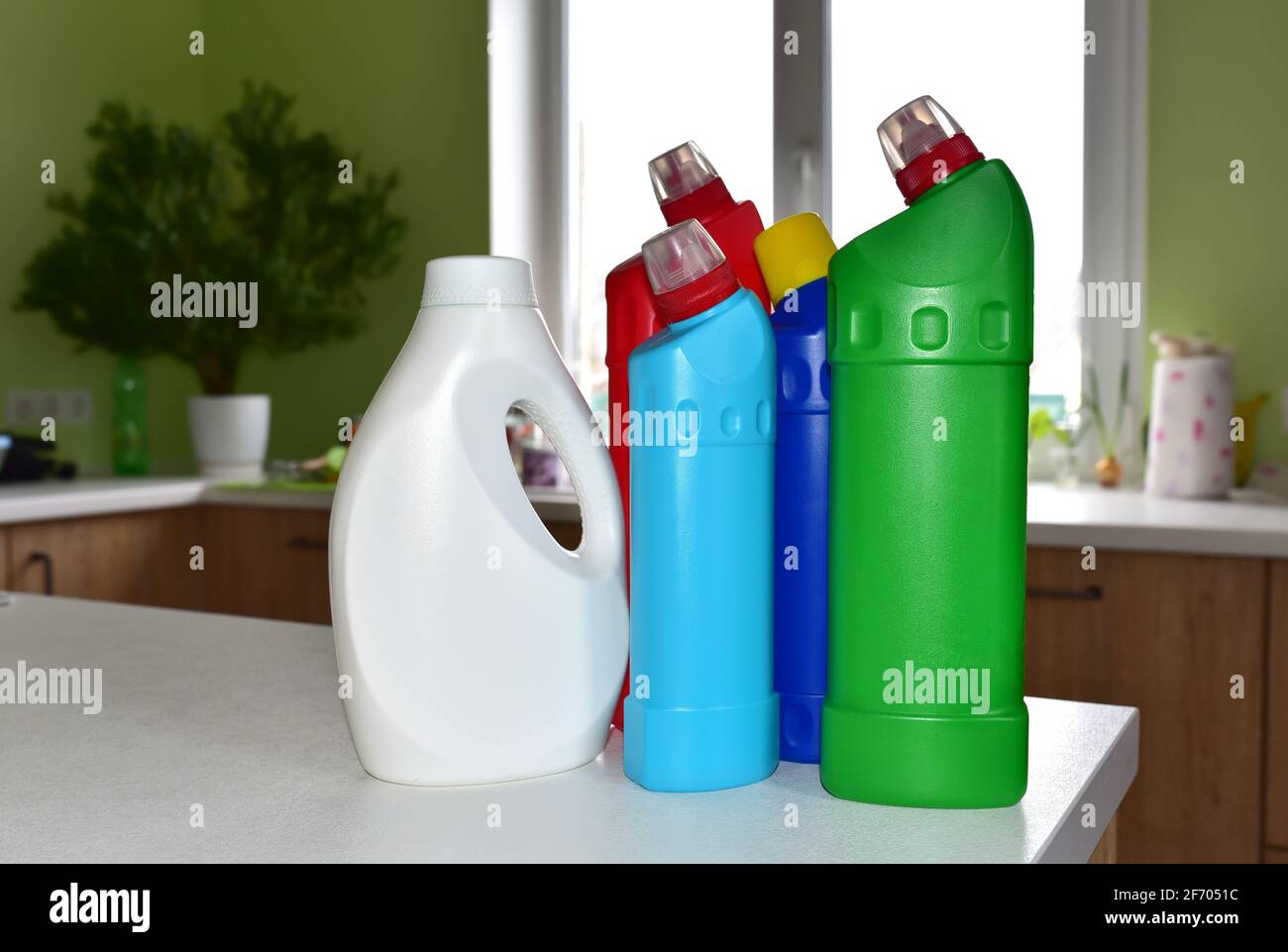 Detergent bottles at kitchen in home. Detergents and laundry concept ...