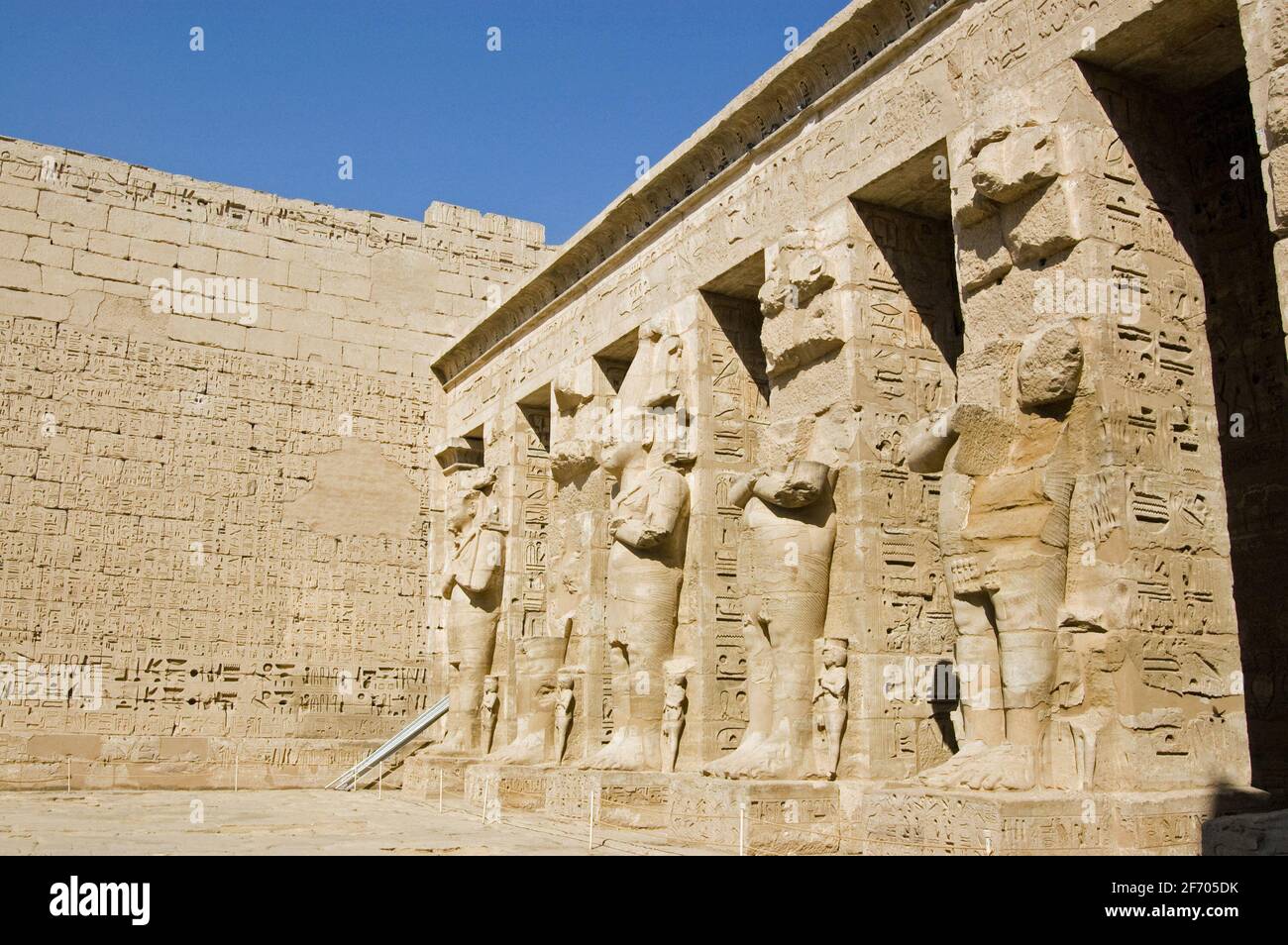 giant statues of the Pharoah Ramses II in an inner courtyard of Medinet ...