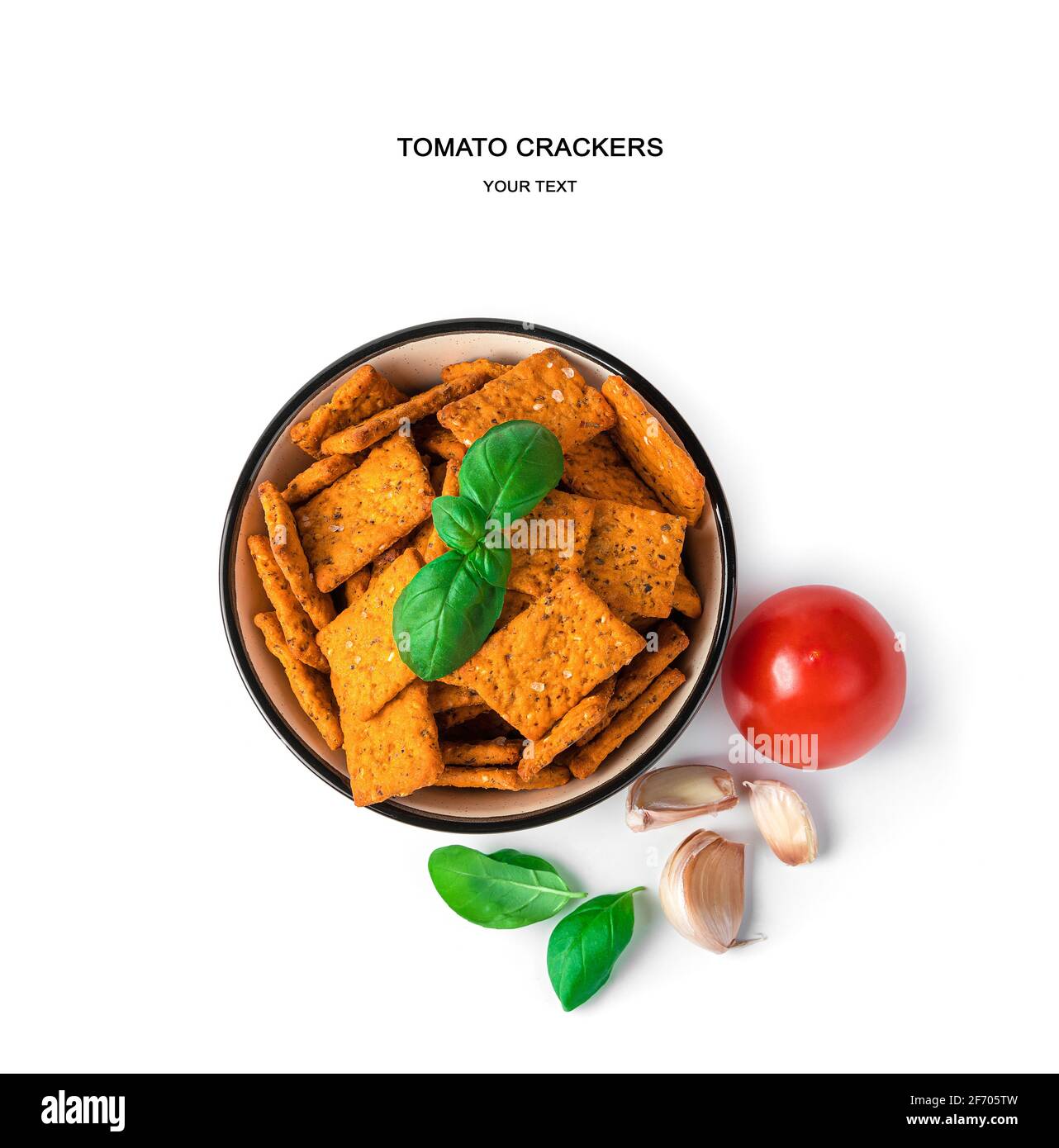 Tomato crackers with sea salt and basil on a background of ingredients ...