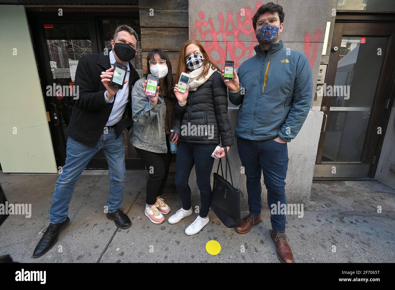 Theatre goers show their virtual tickets on their smartphones as ...