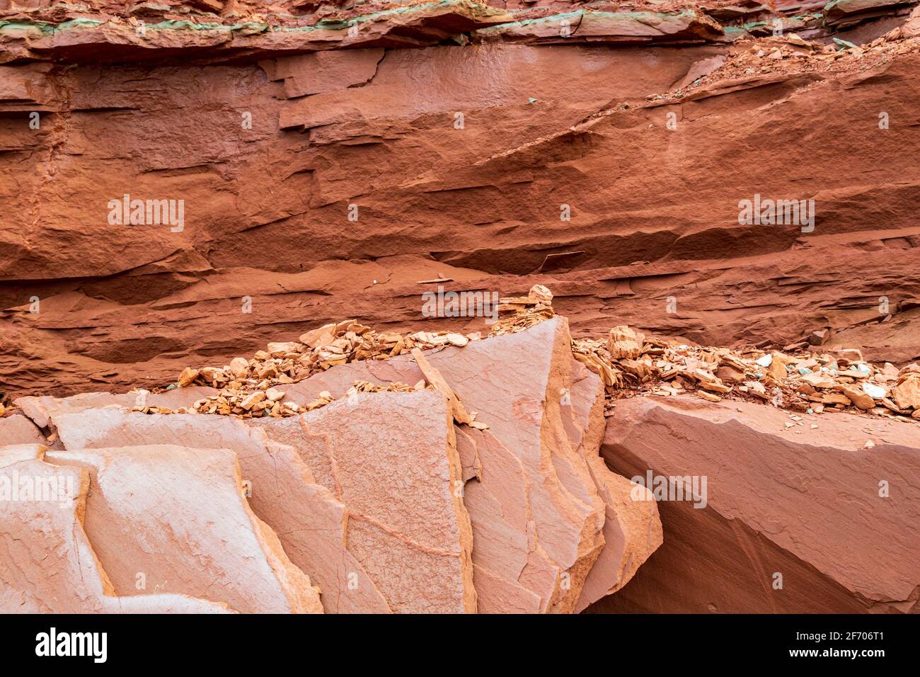 Red and Turquoise sedimentary sandstone cliff and rocks at Cavendish ...