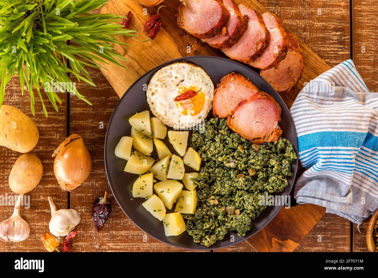 Traditional Czech Easter food. Spinach with potatoes and fried egg ...