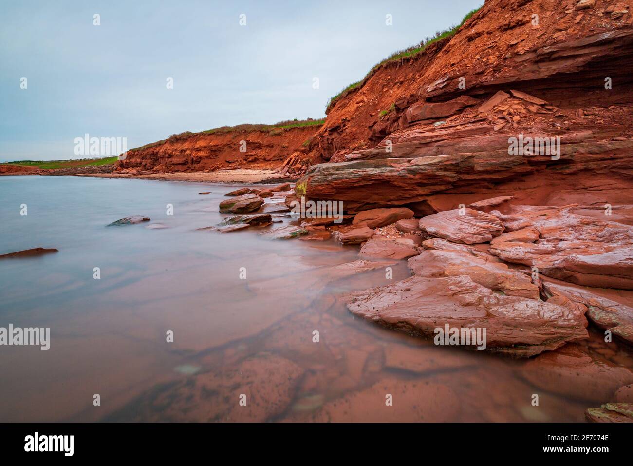 At Cavendish beach, on Canada's Prince Edward Island, the flat red ...