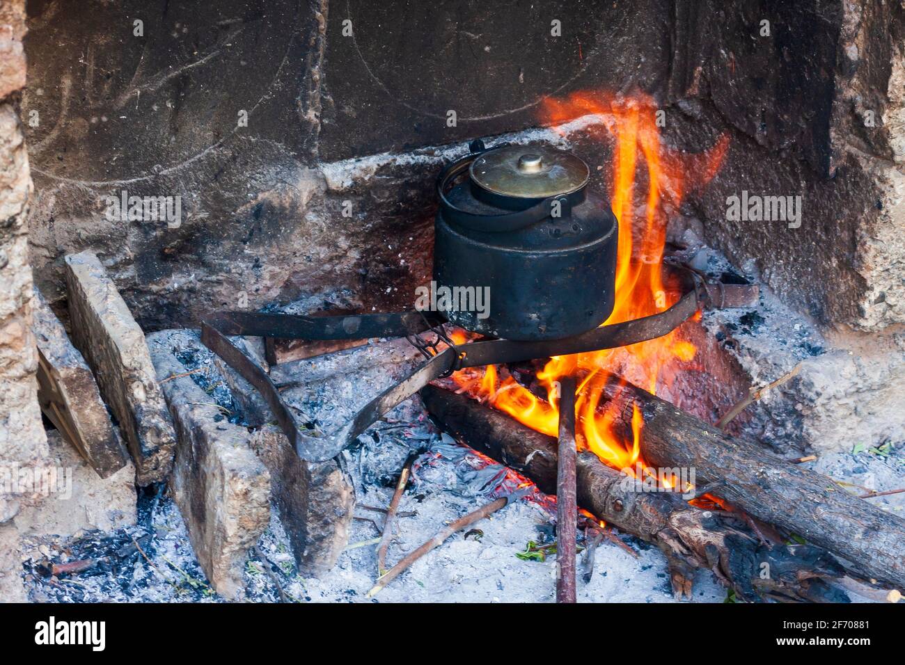 A kettle heated on a fire Stock Photo - Alamy