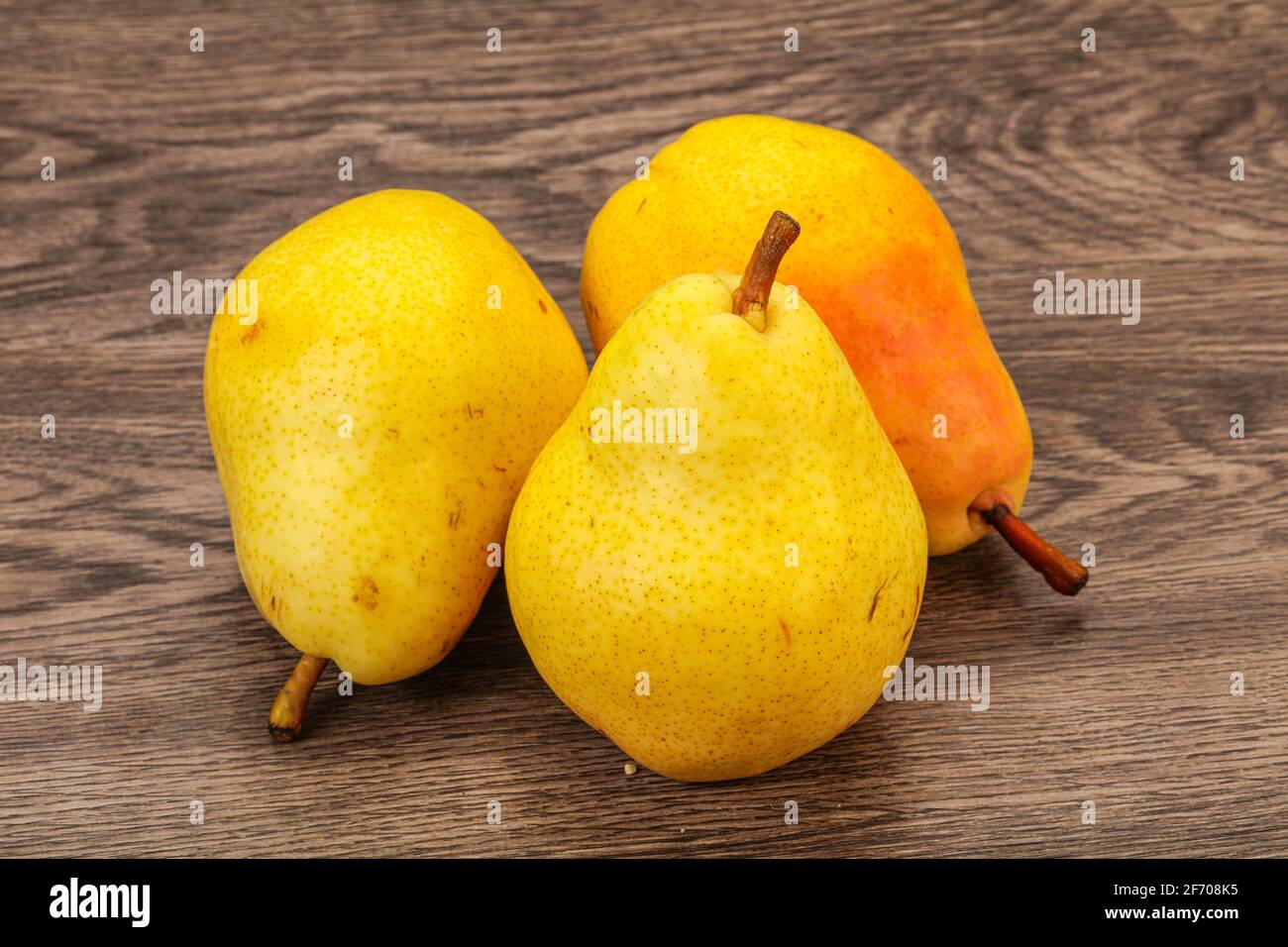 Fresh sweet yellow pear over background Stock Photo - Alamy