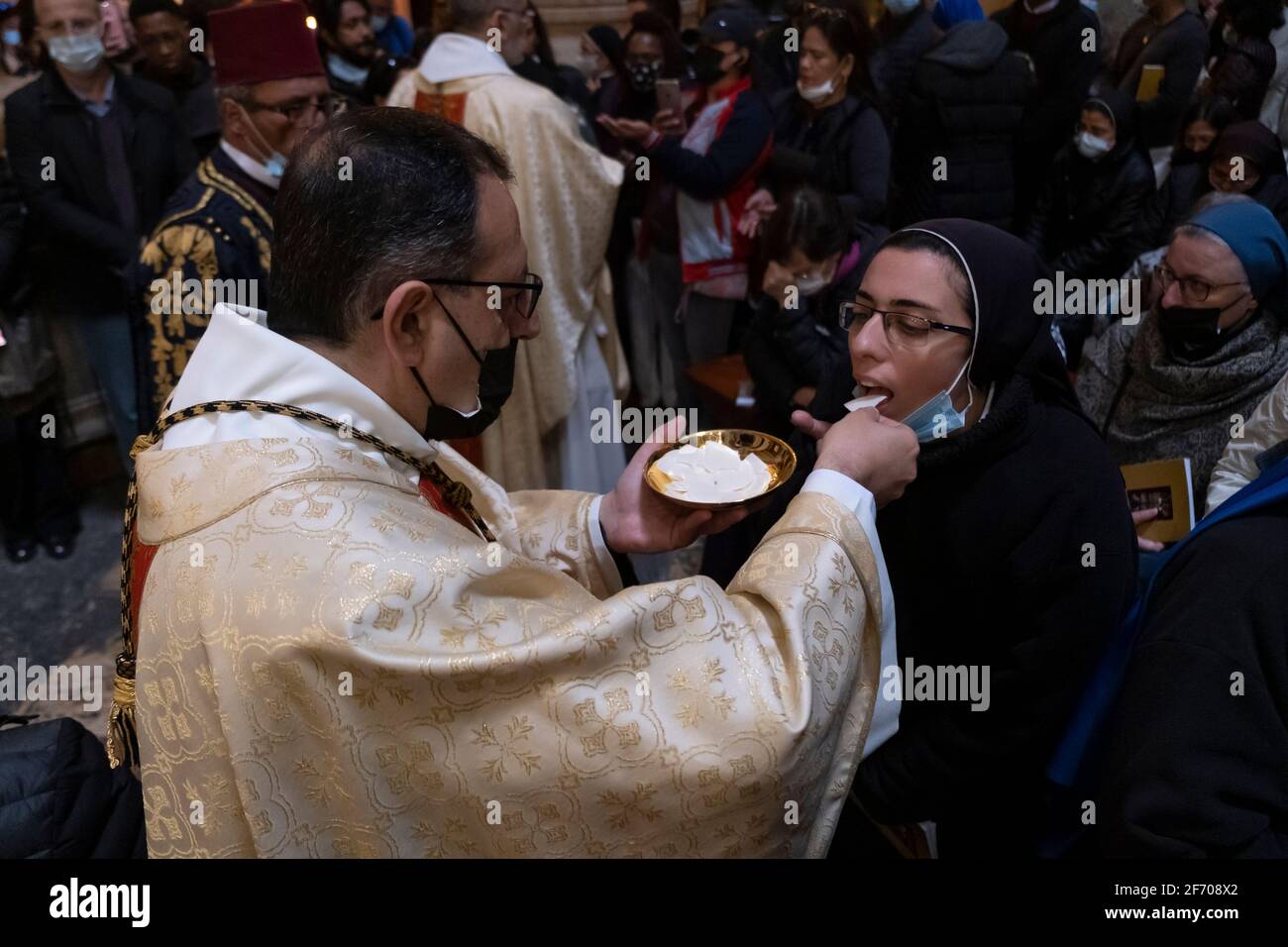 Worshiper wearing mask hi-res stock photography and images - Alamy