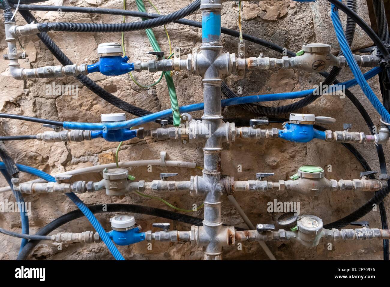Domestic water meters and pipes in the old city of Jerusalem Israel ...