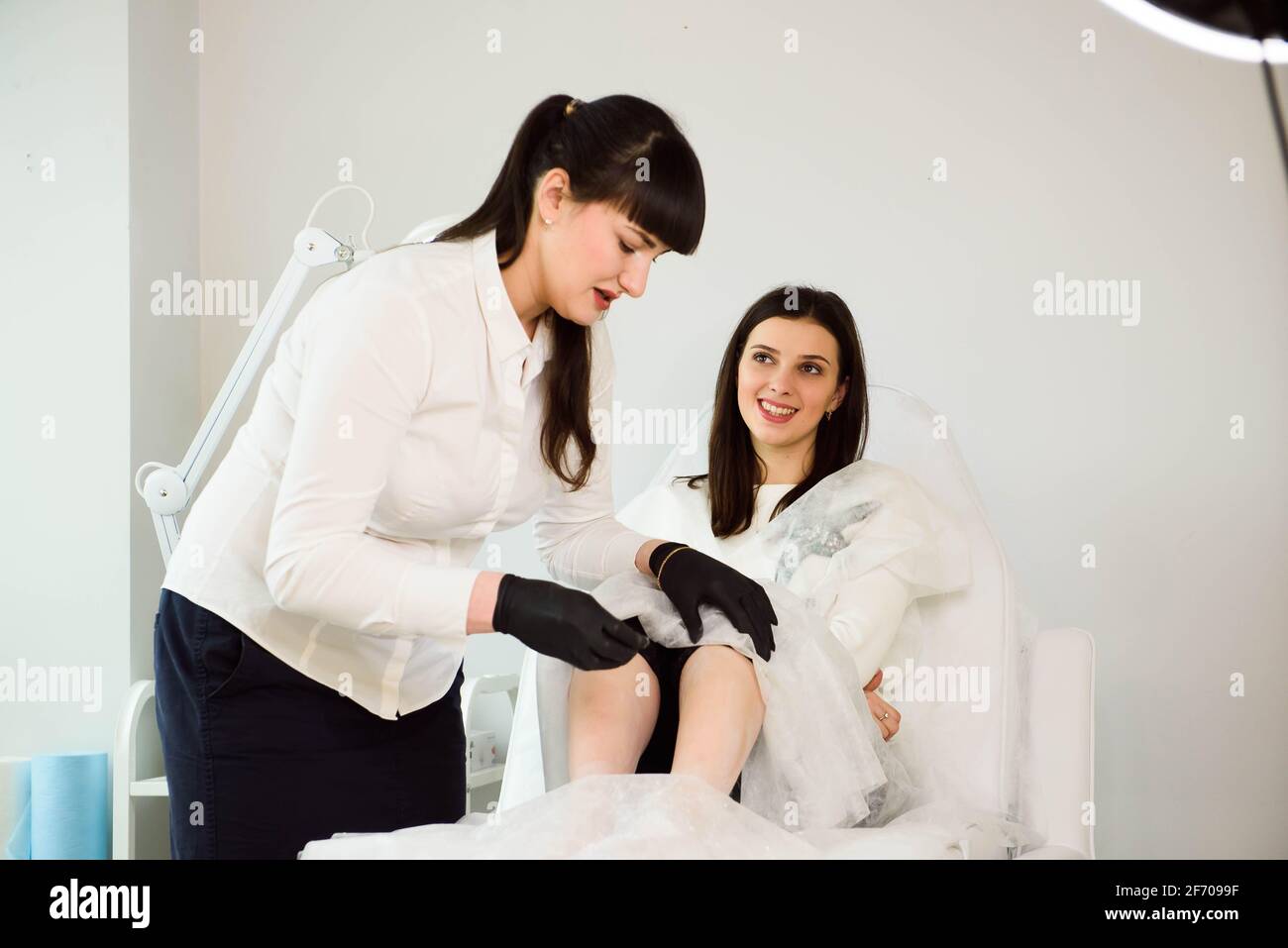 Process depilation female legs and hands in a beauty salon Stock Photo ...