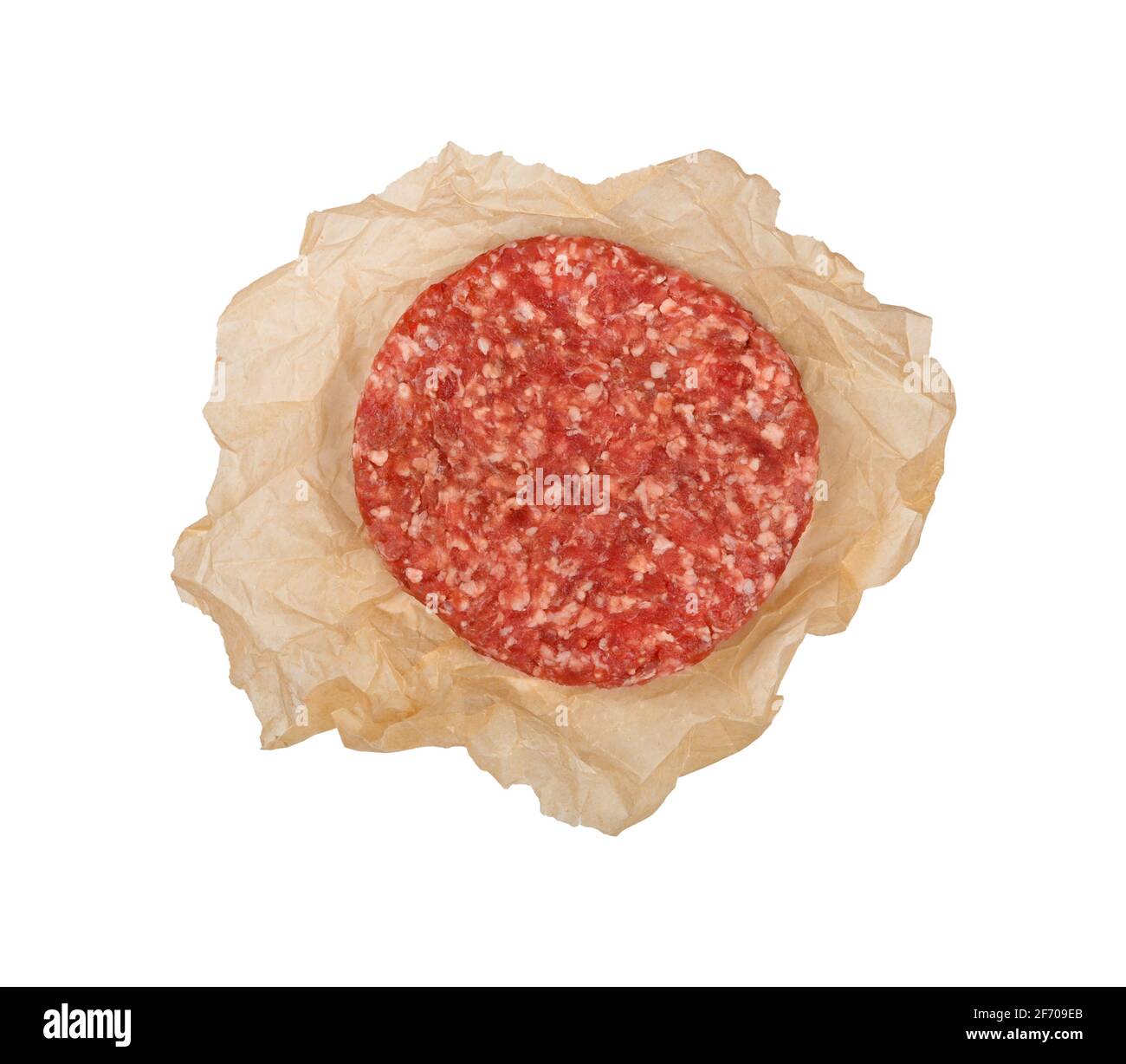 One fresh raw beef meat burger for hamburger wrapped in brown paper ...