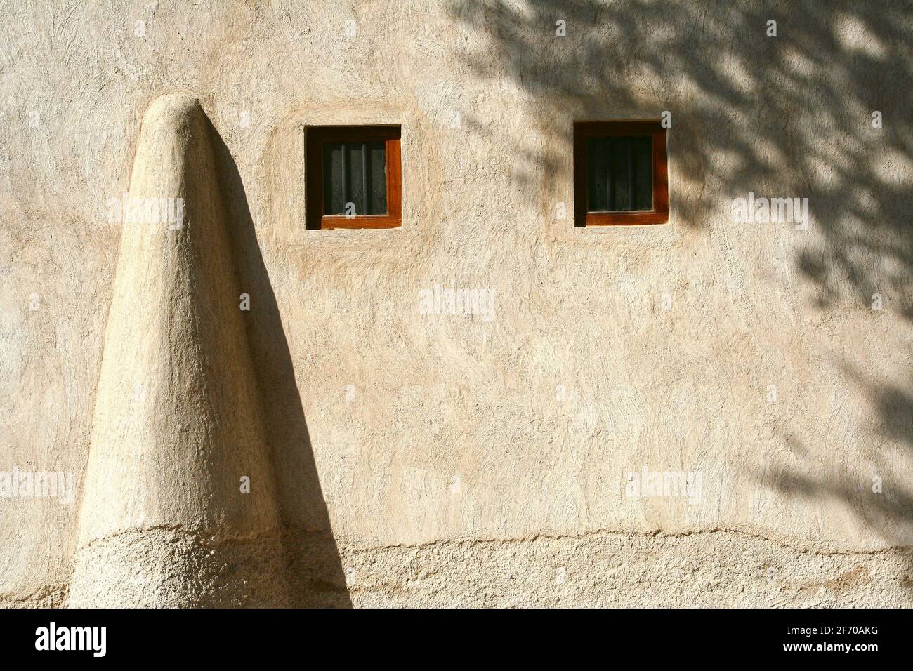 Adobe Wall and wooden Window Stock Photo - Alamy