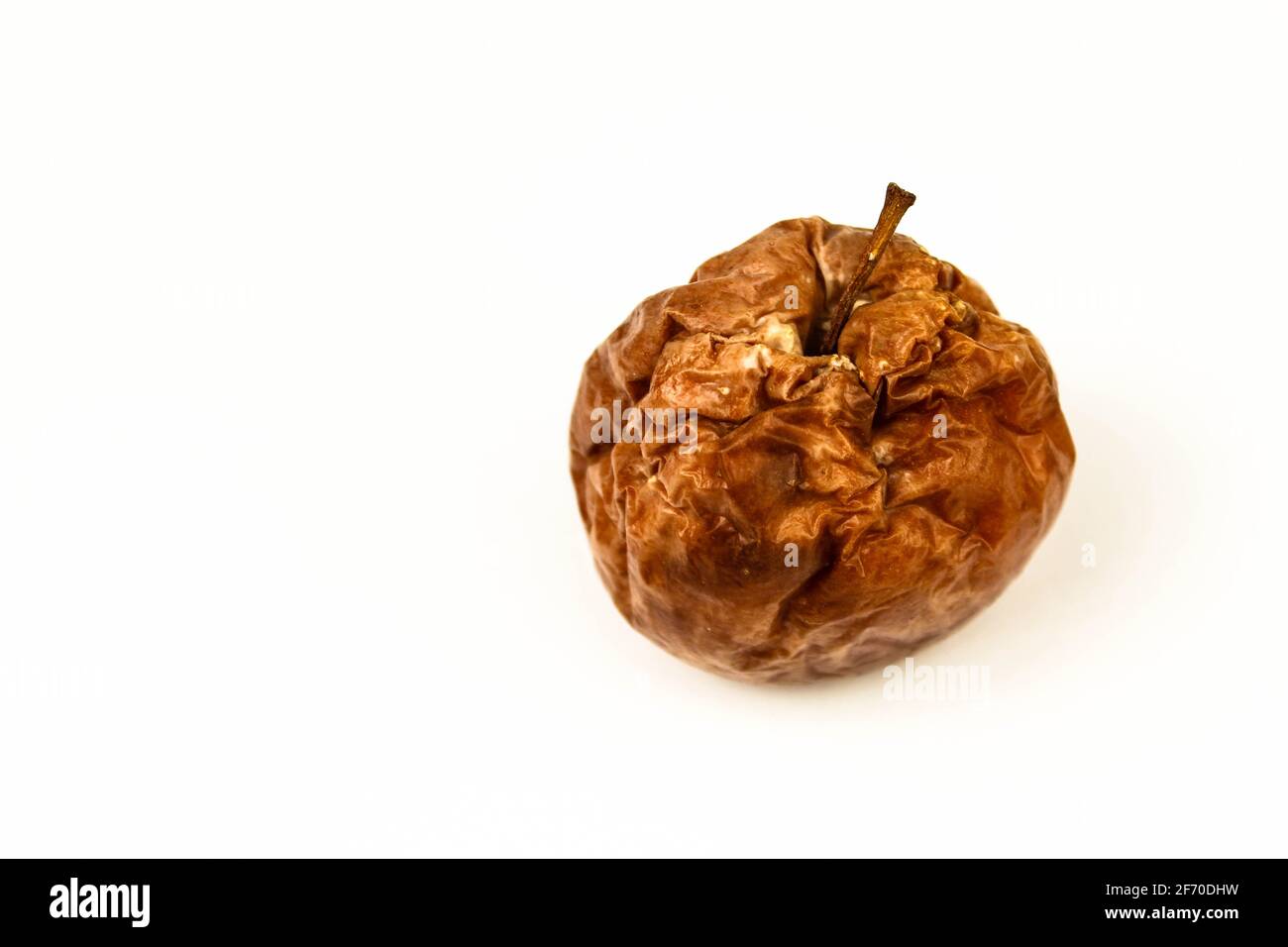 Old rotten apple with large DOF on white background Stock Photo - Alamy