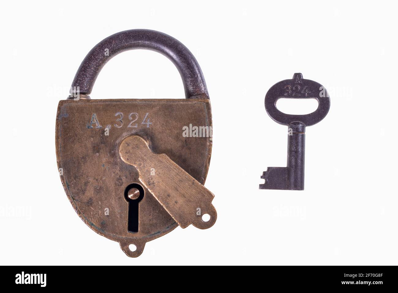 Old metal padlock with a key. Accessories for securing gates and doors ...